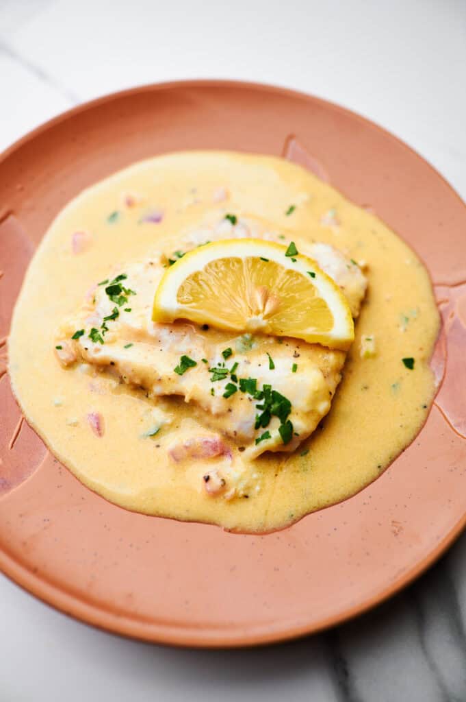 Baked Fish with Lemon Cream Sauce - Ambitious Foodie